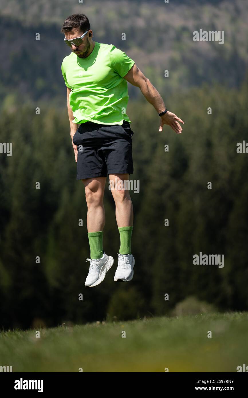 Man Jumping To His Maximum Height In Open Air Stock Photo - Alamy