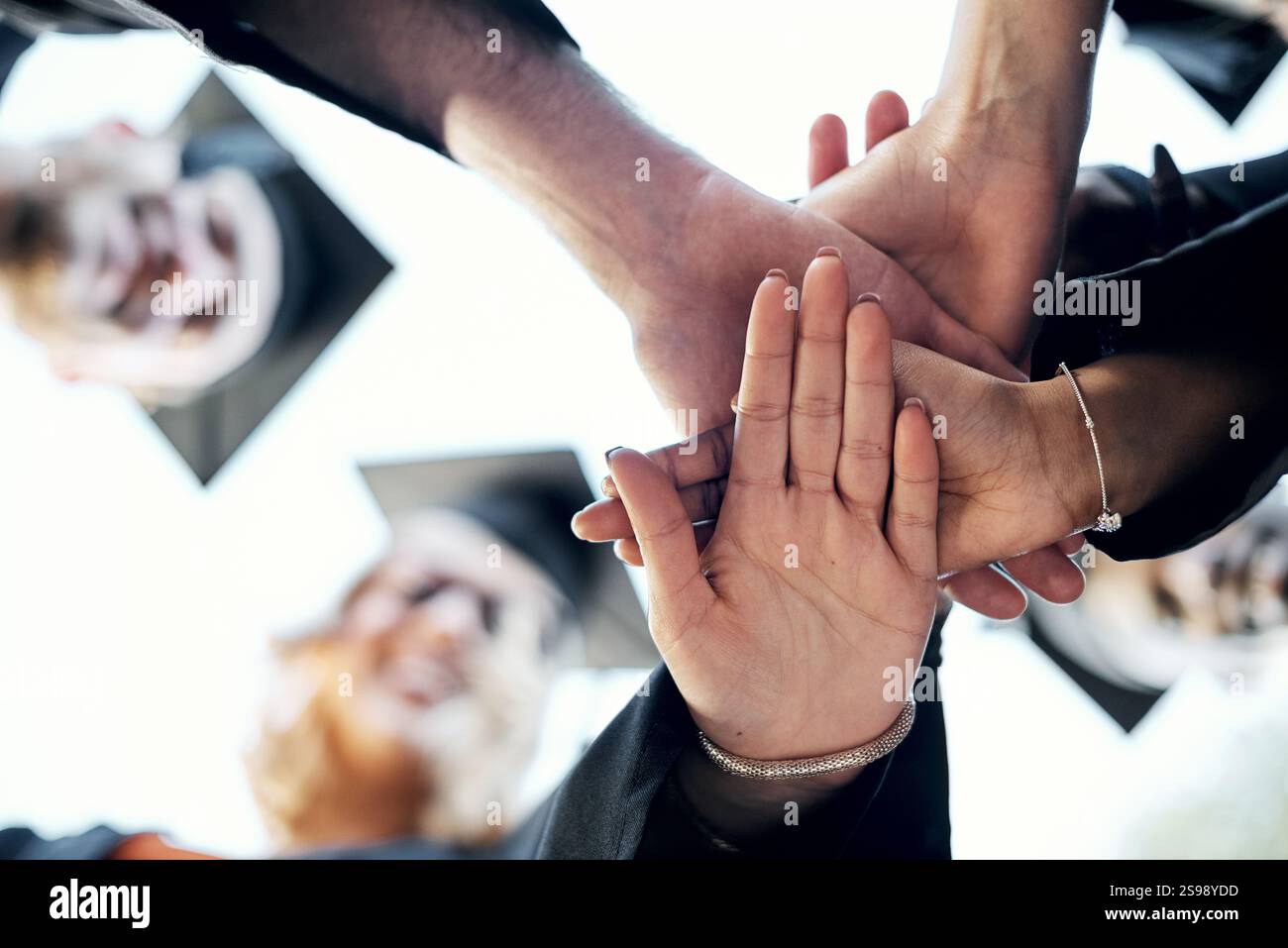 People, students and hands together with graduation for teamwork ...