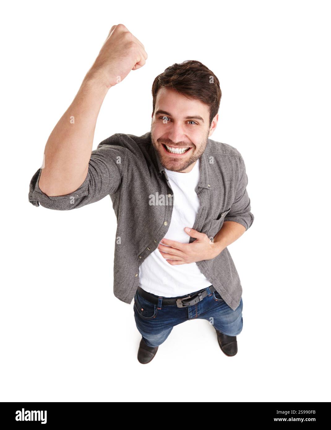 Man, fist pump and celebrate winning in studio, confident guy and ...