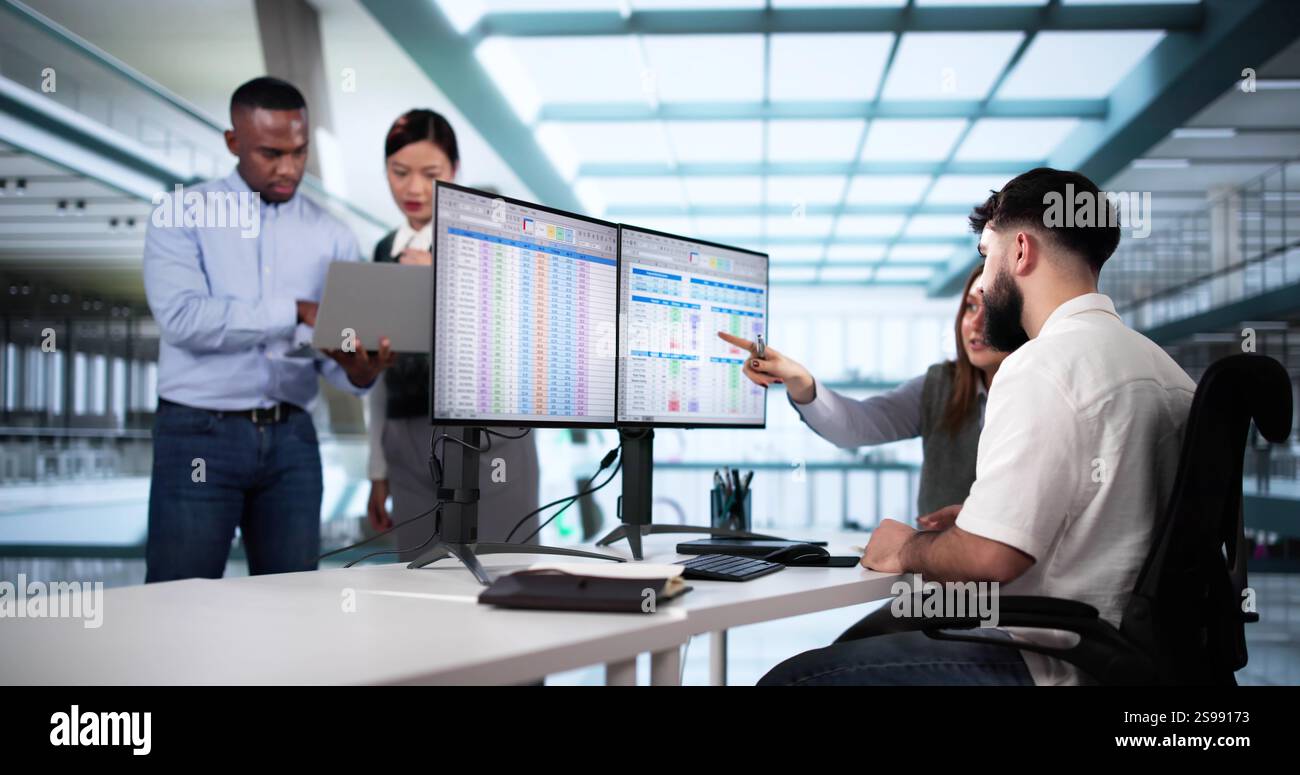 People Working With Spreadsheet Data On Computer Monitor Stock Photo ...