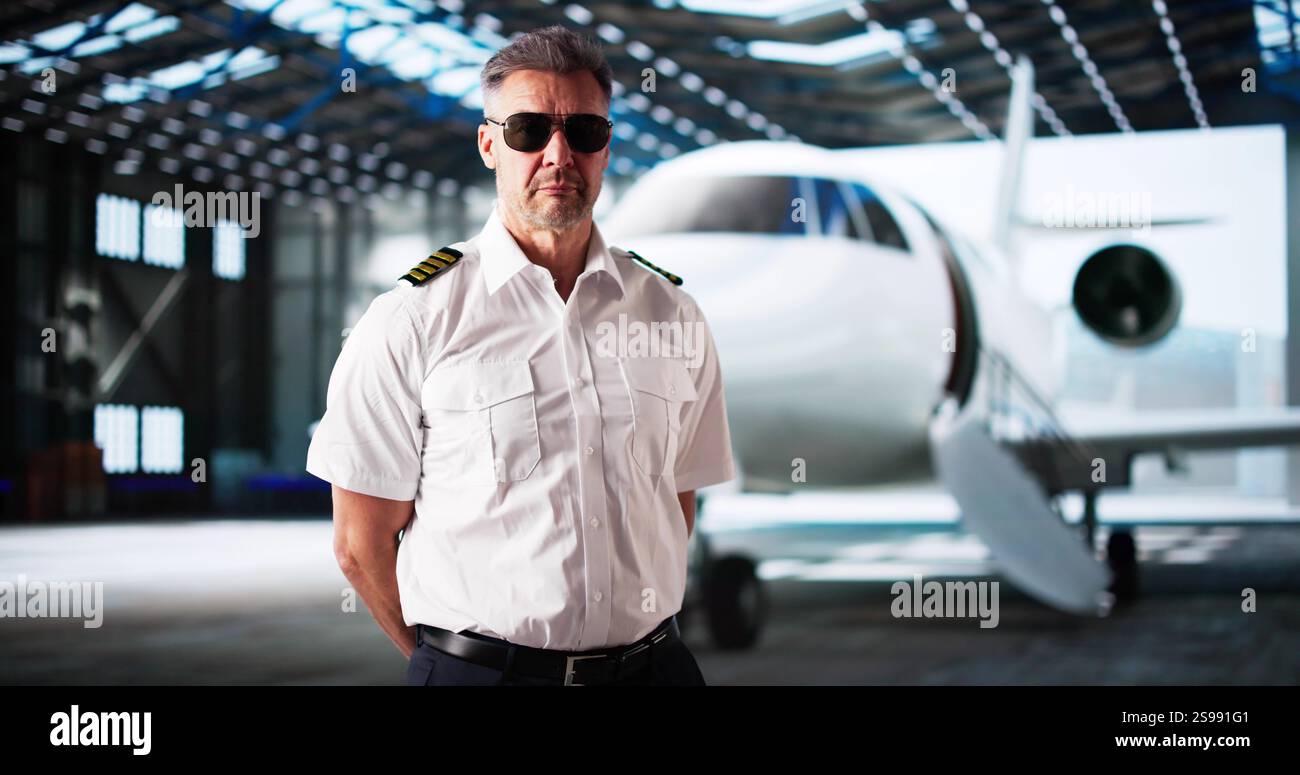 Private Jet Captain Pilot In Uniform. Small Airplane At Airport Stock ...