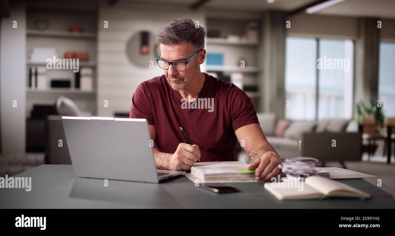 Man Doing Taxes And Family Budget On Computer Stock Photo - Alamy