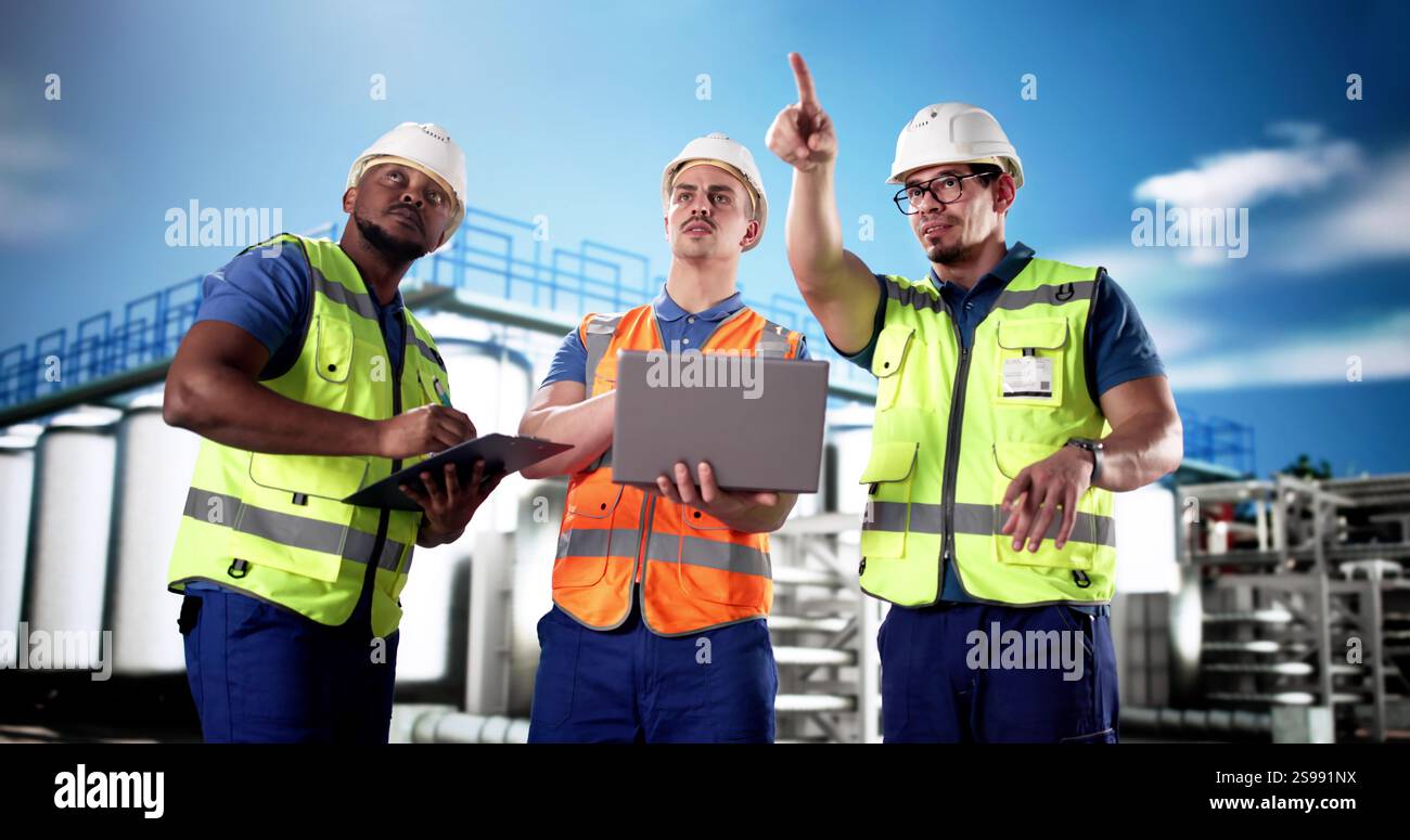 Diverse group of facility managers inspecting safety at industrial site ...