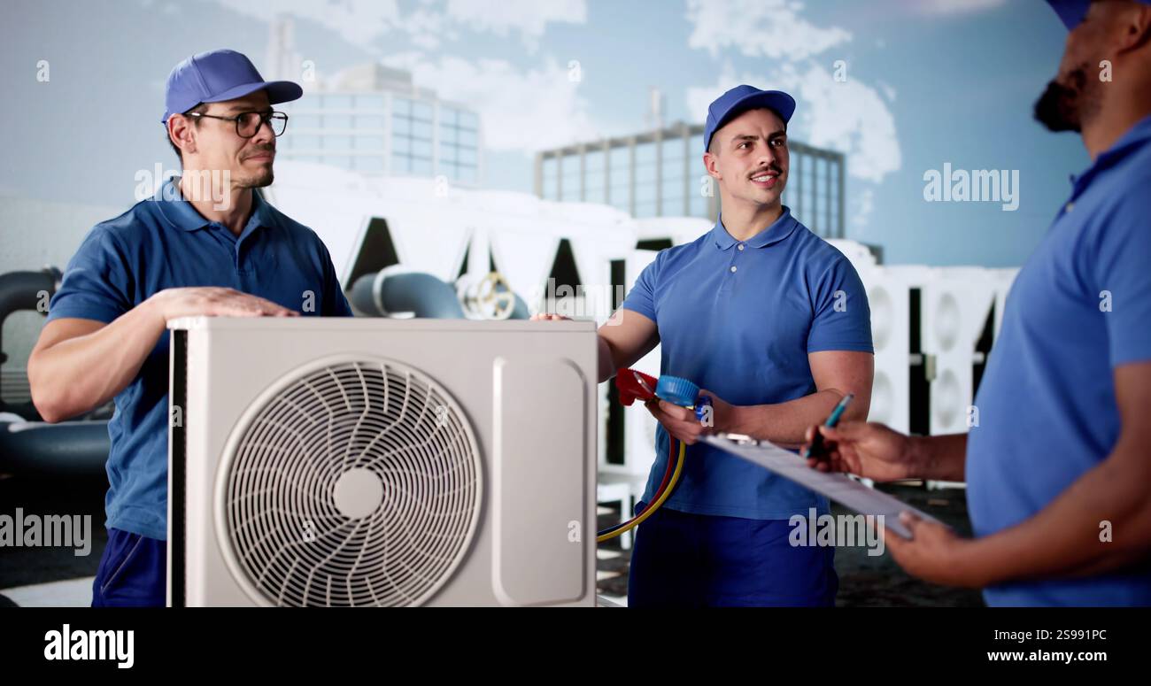 Diverse Group of Workers Installing Air Conditioner on Commercial ...