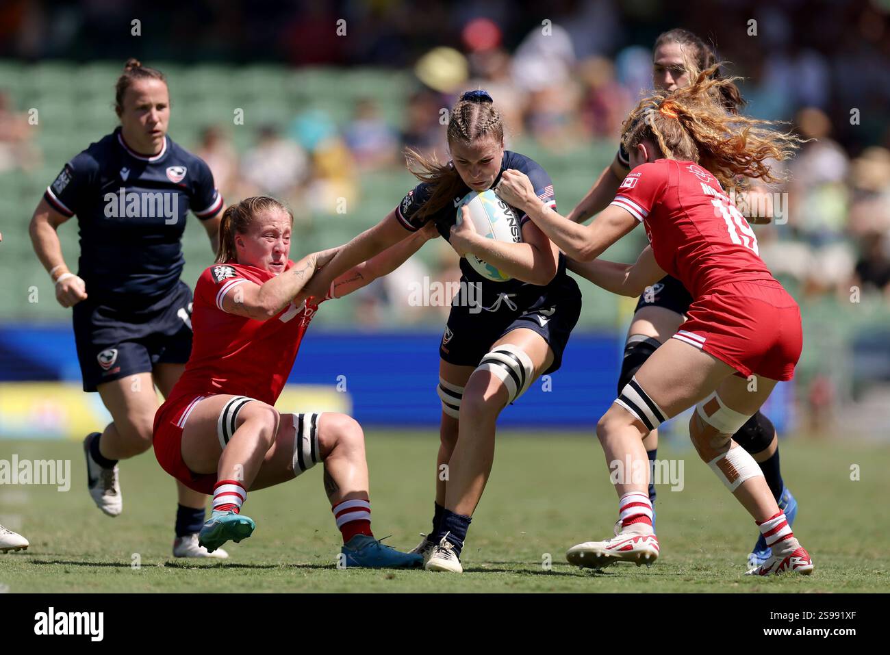 Rachel Strasdas of the USA is tackled during the match between the USA ...