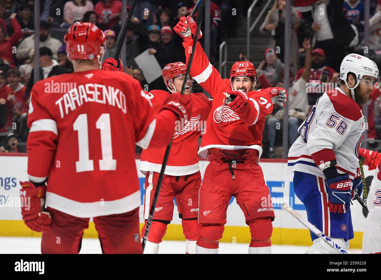 Detroit Red Wings center Dylan Larkin, second from right, points at ...