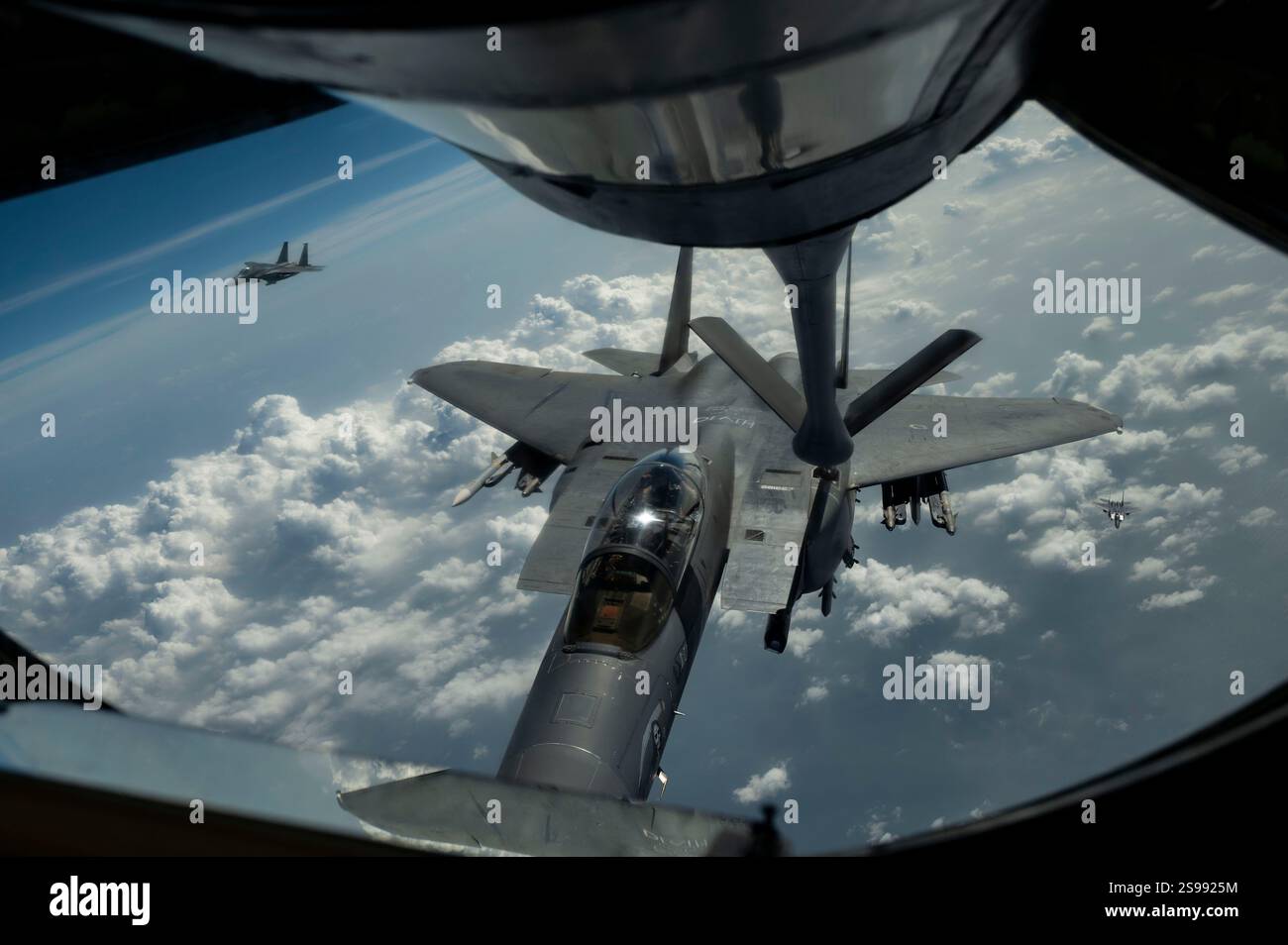 A U.S. Air Force F-15E Strike Eagle is refueled over the U.S. Central ...
