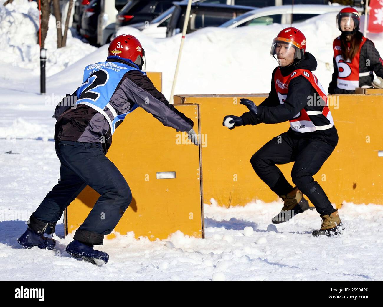 Participants throw snowballs during the Hokkaido Openl Yukigassen ...