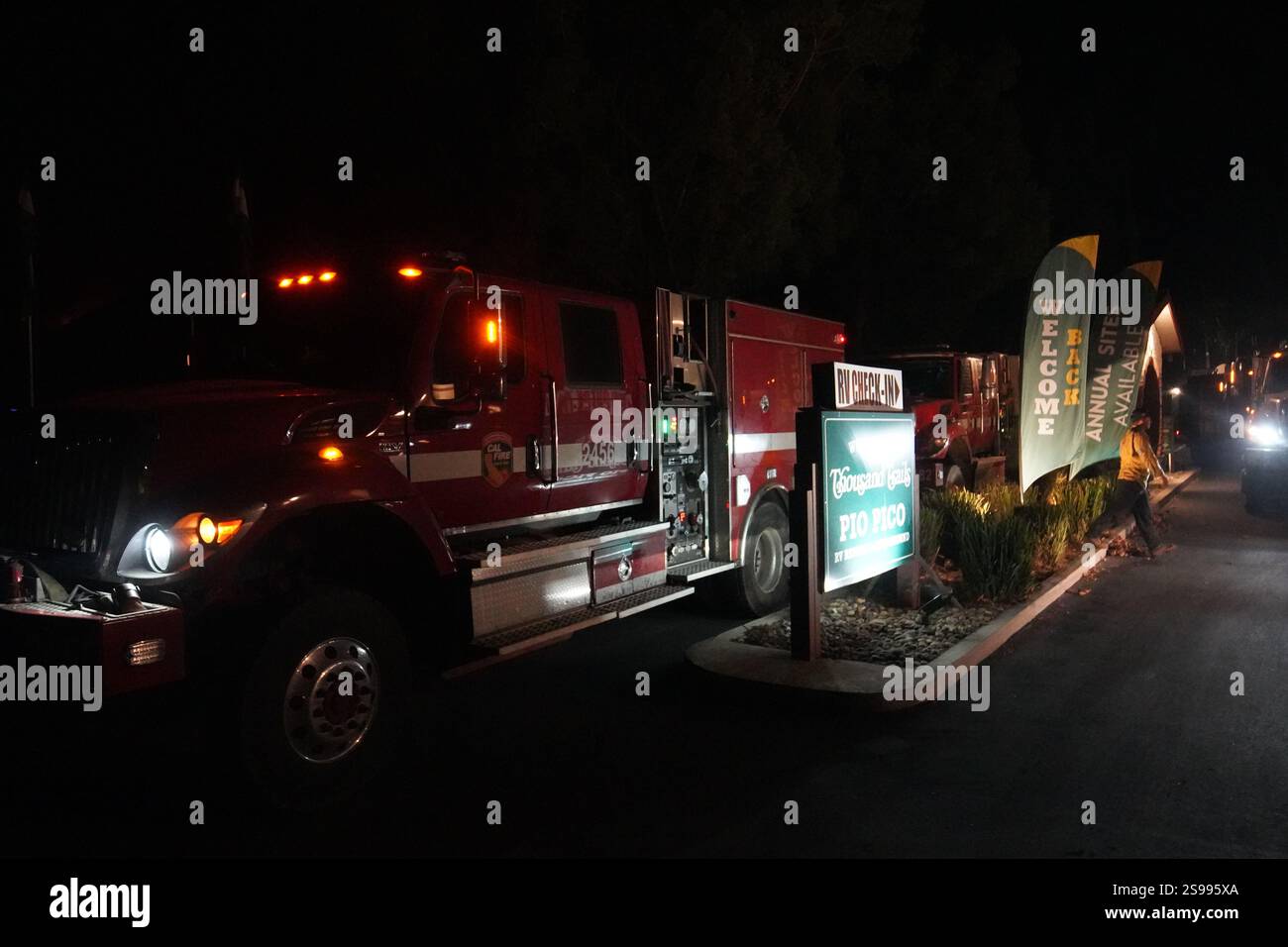 Fire trucks on standing by near the Otay Lake. The Border 2 Fire ...