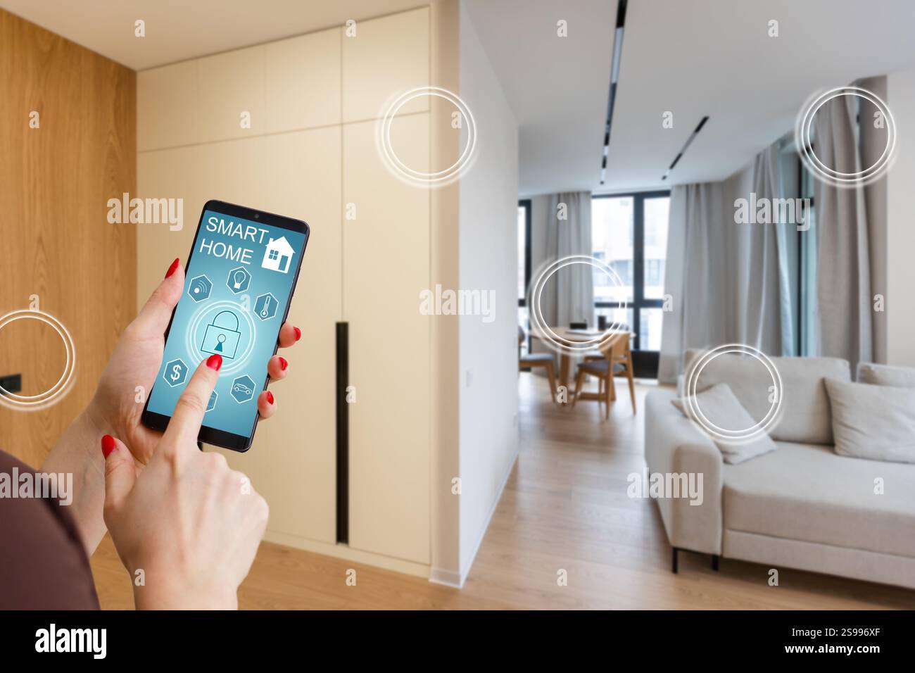 Smart home technology interface on smartphone app screen with augmented ...