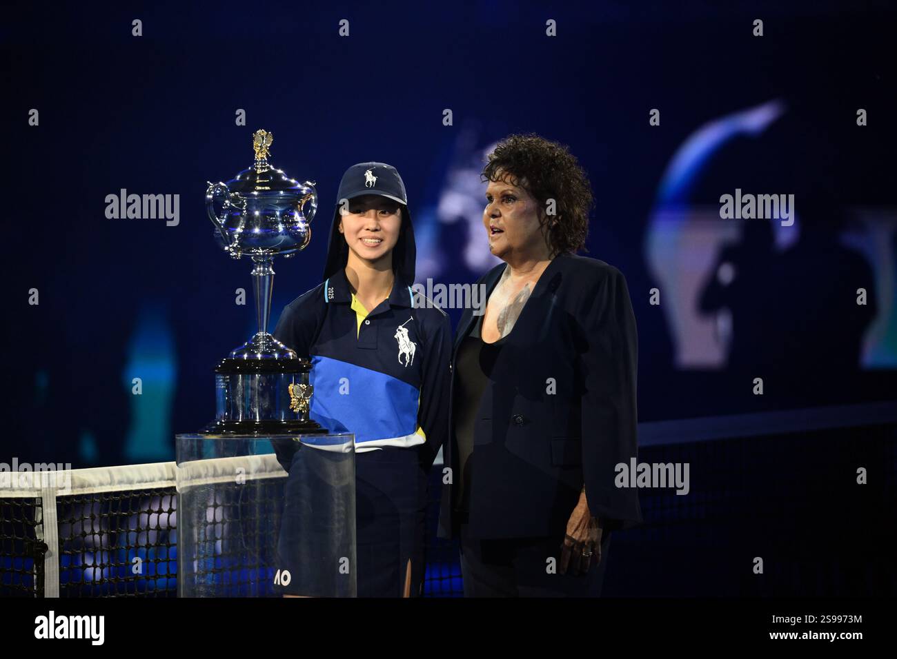 Evonne Goolagong Cawley is joined by a ball kid and the Daphne Akhurst Nenorial Trophy ahead of ...