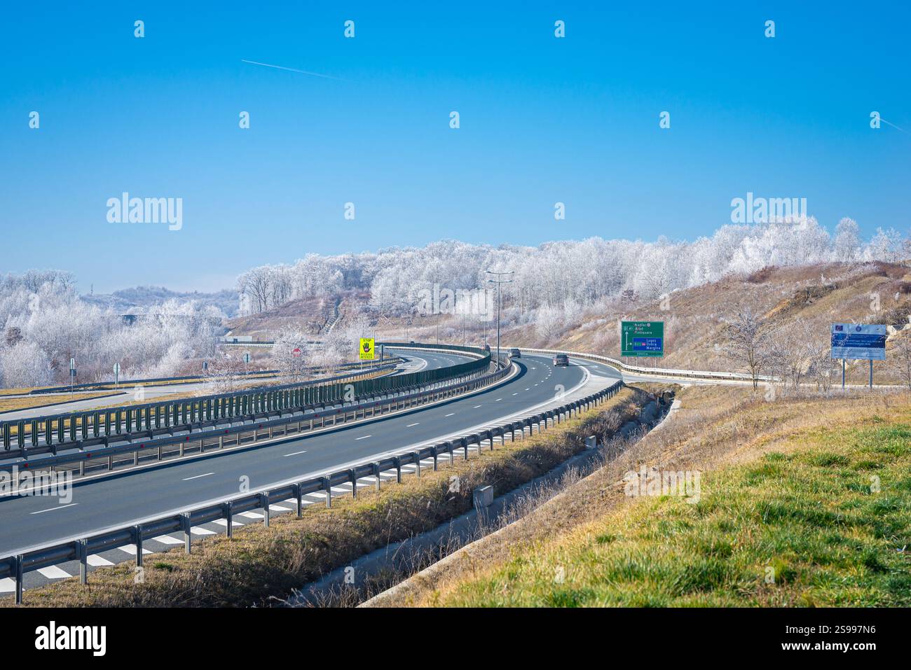 Highway A1 in a winter landscape in the mountains of Transylvania, west ...