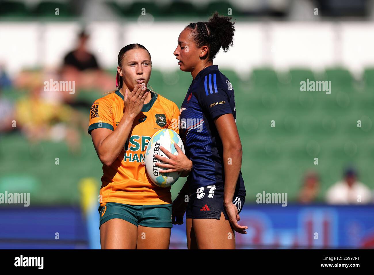 Teagan Levi of Australia reacts after scoring a try as Kelly Arbey of ...
