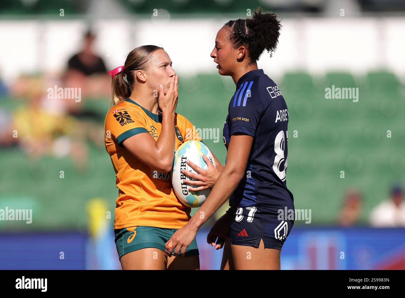 Teagan Levi of Australia reacts after scoring a try as Kelly Arbey of ...