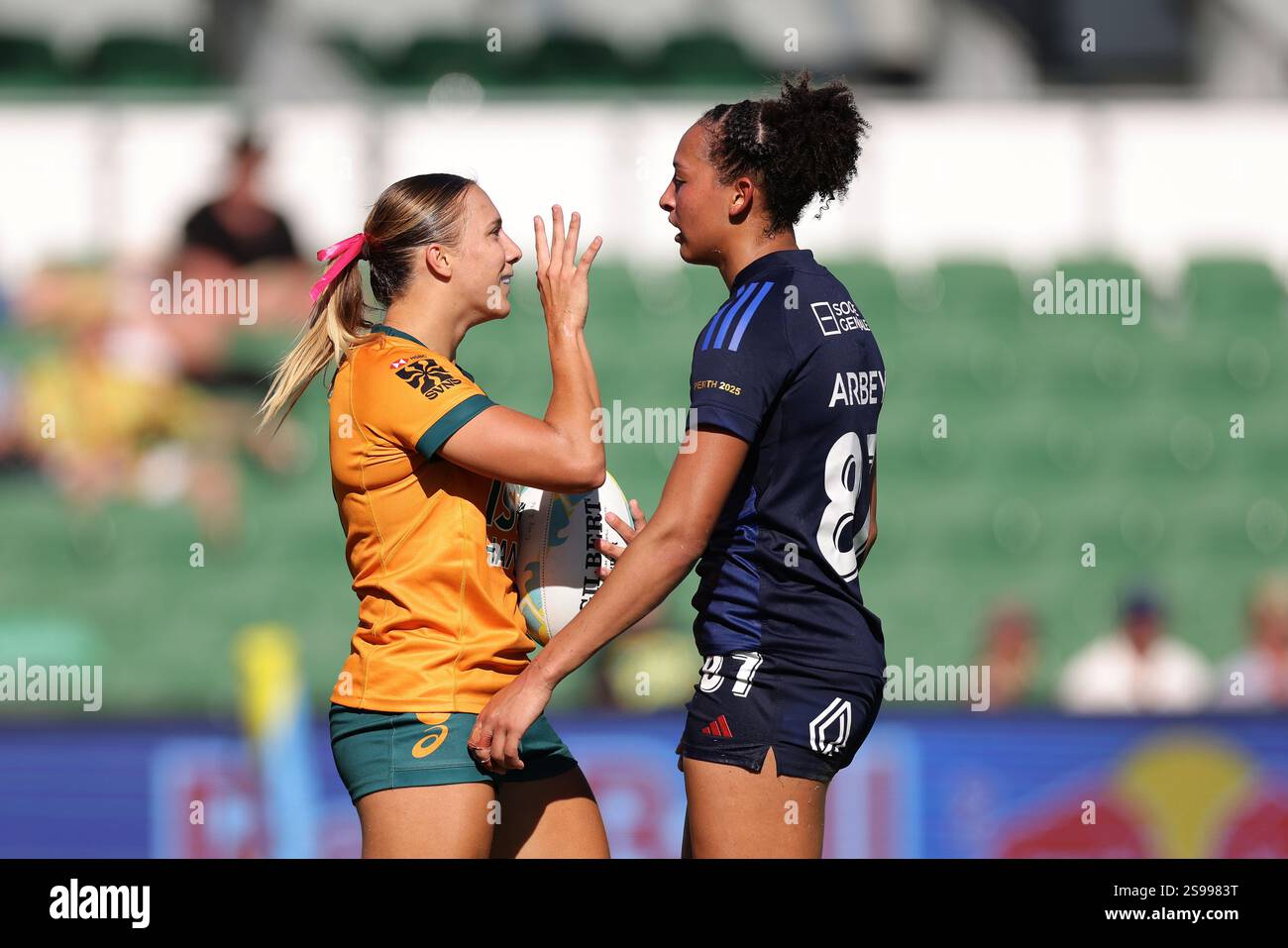 Teagan Levi of Australia reacts after scoring a try as Kelly Arbey of ...