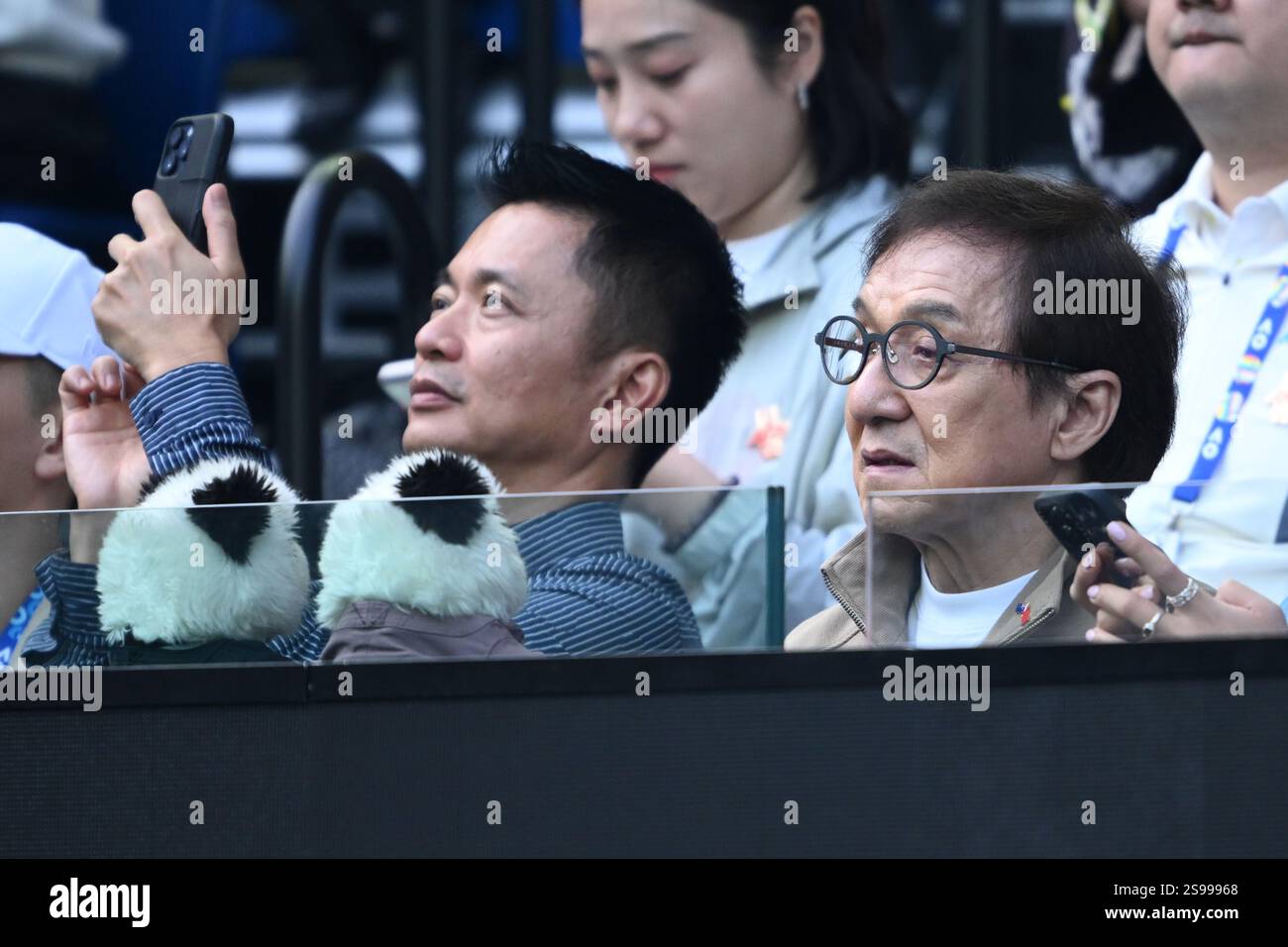 Hong Kong actor and driectorJackie Chan (right) watches Aryna Sabalenka ...
