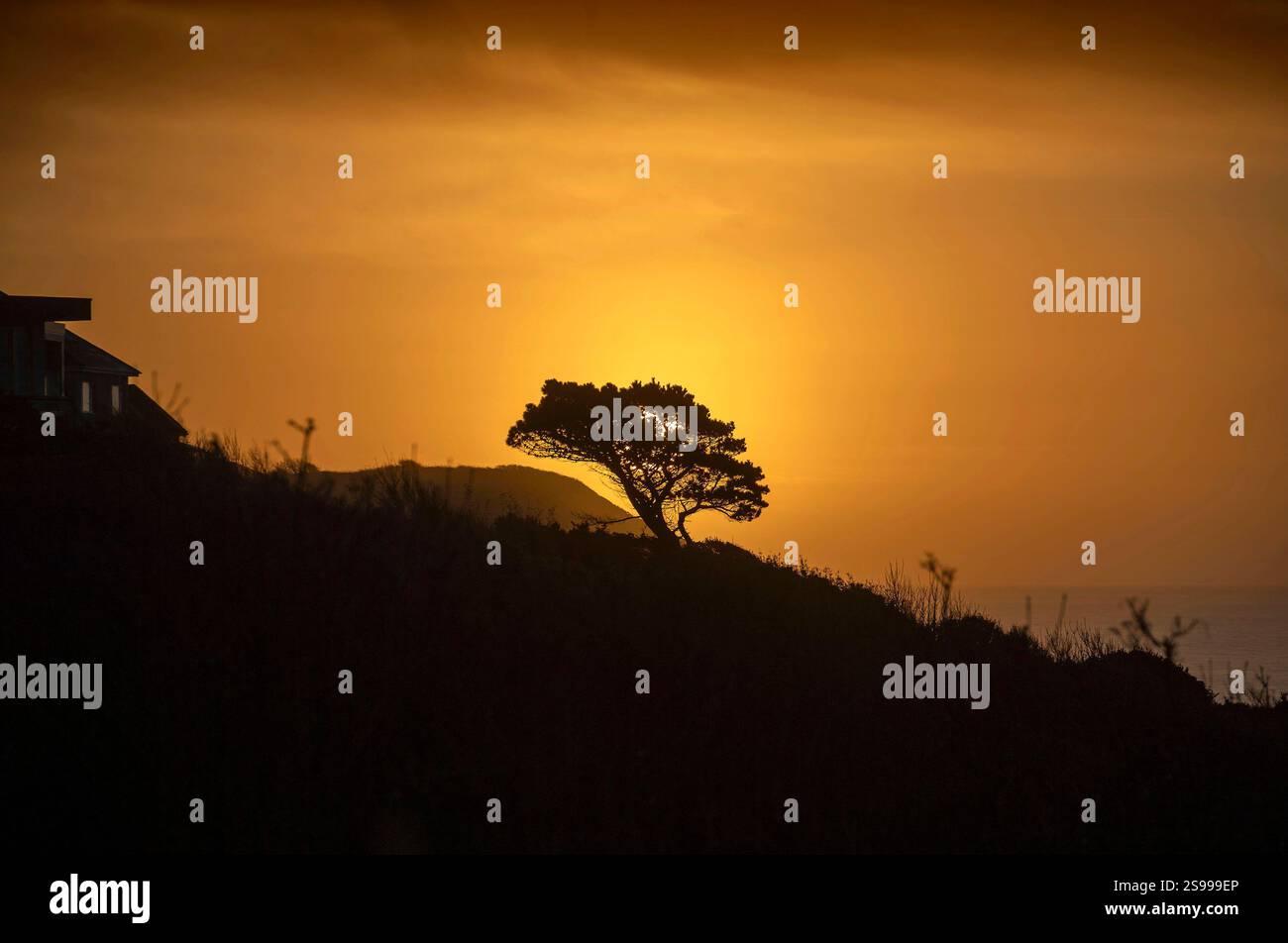 The sun rises at Langland Bay, Swansea as the air temperature struggles ...
