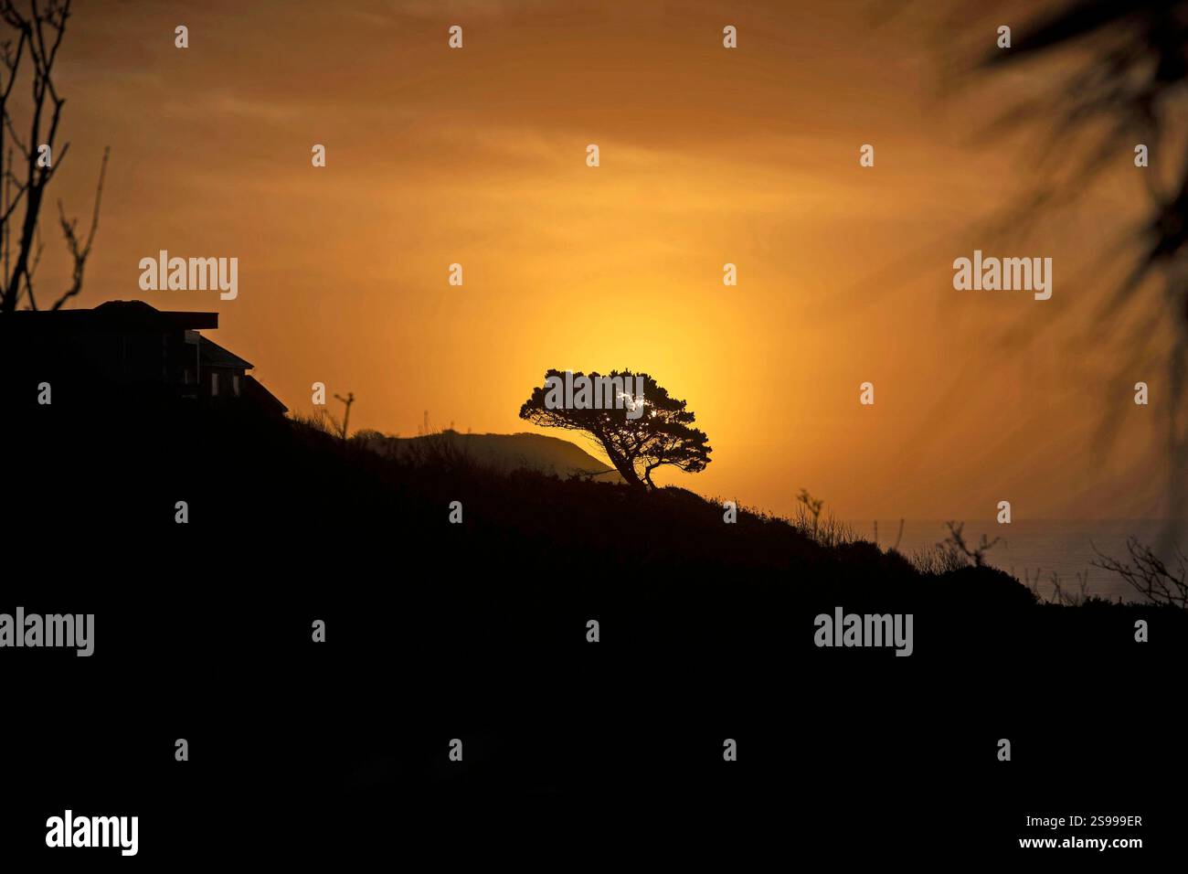 The sun rises at Langland Bay, Swansea as the air temperature struggles ...