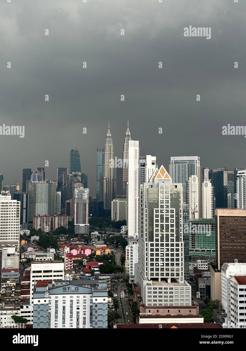 Kulala Lumpur Skyline with grey dark sky Stock Photo - Alamy