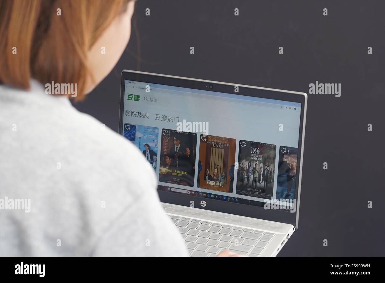 In this photo illustration, A woman browses Douban website on her ...