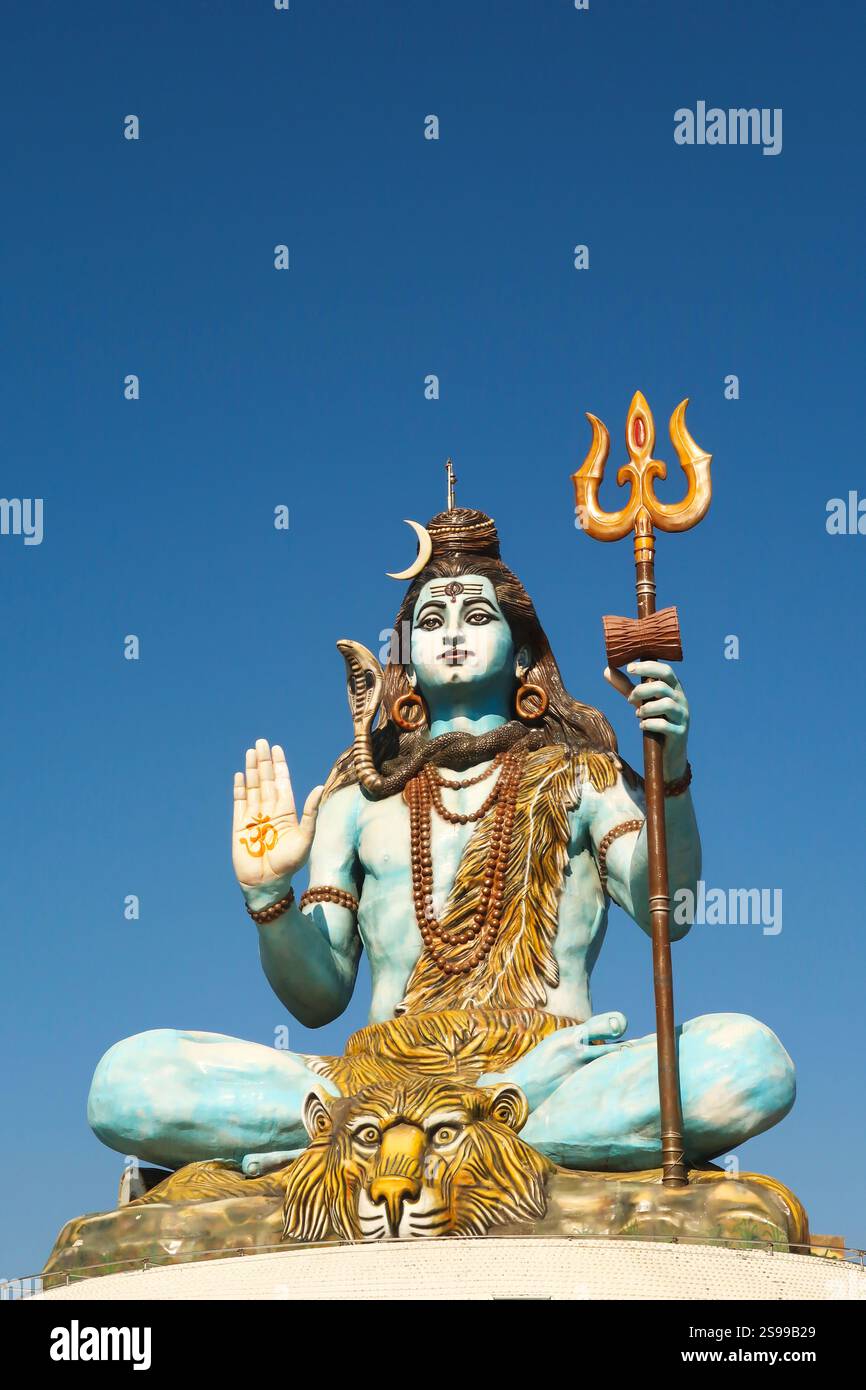The big blue statue of the Hindu God Lord Shiva at the Pumdikot ...