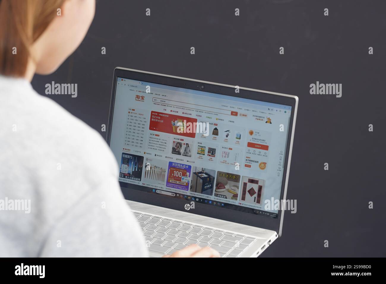January 22, 2025, China: In this photo illustration, A woman browses TaoBao website on her ...
