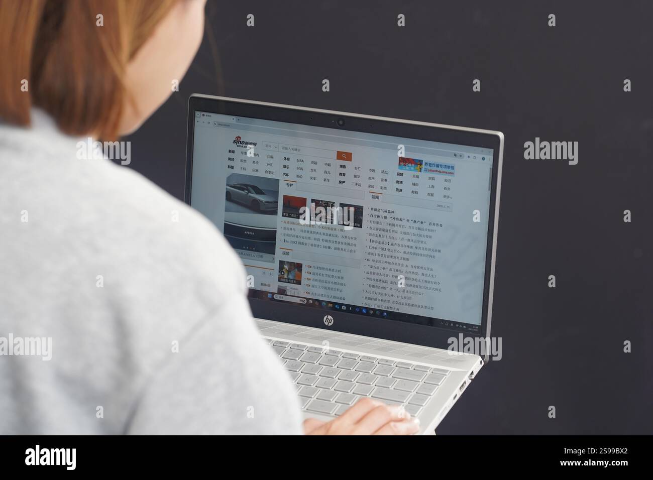 January 22, 2025, China: In this photo illustration, A woman browses ...
