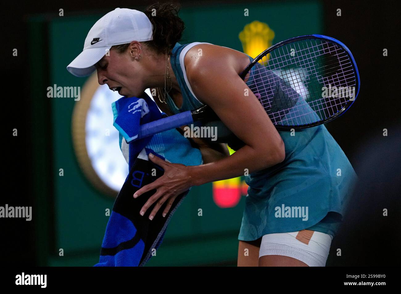 Madison Keys of the U.S. wipes sweat from her face during her match ...