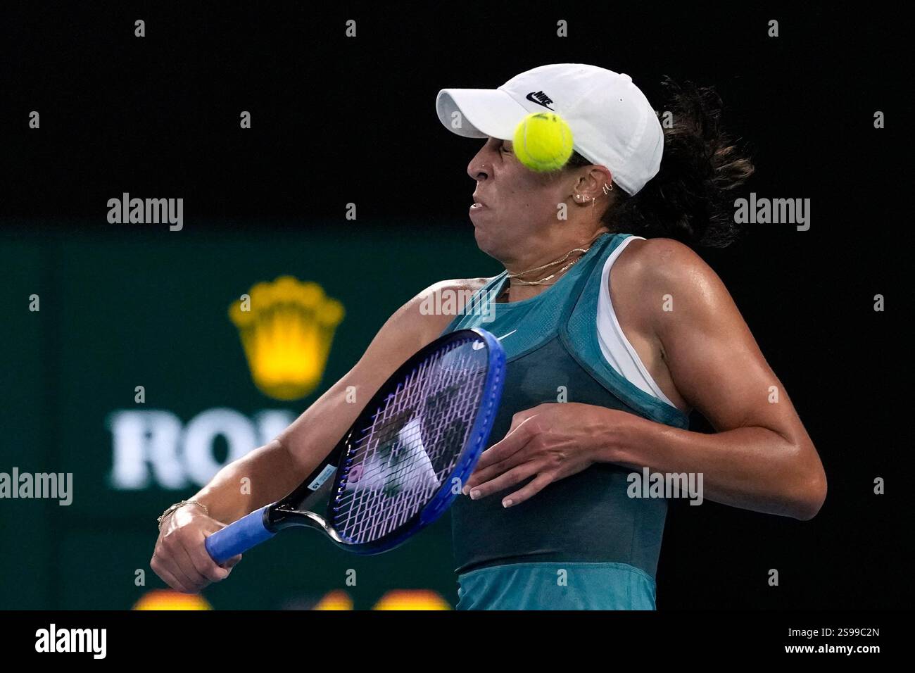 Madison Keys of the U.S. reacts as the ball deflects off her racket ...