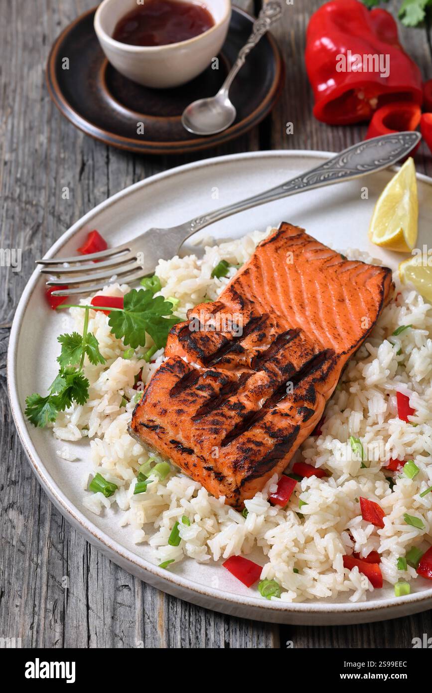 grilled red salmon fillet with jasmine rice, cilantro and lemon slices ...