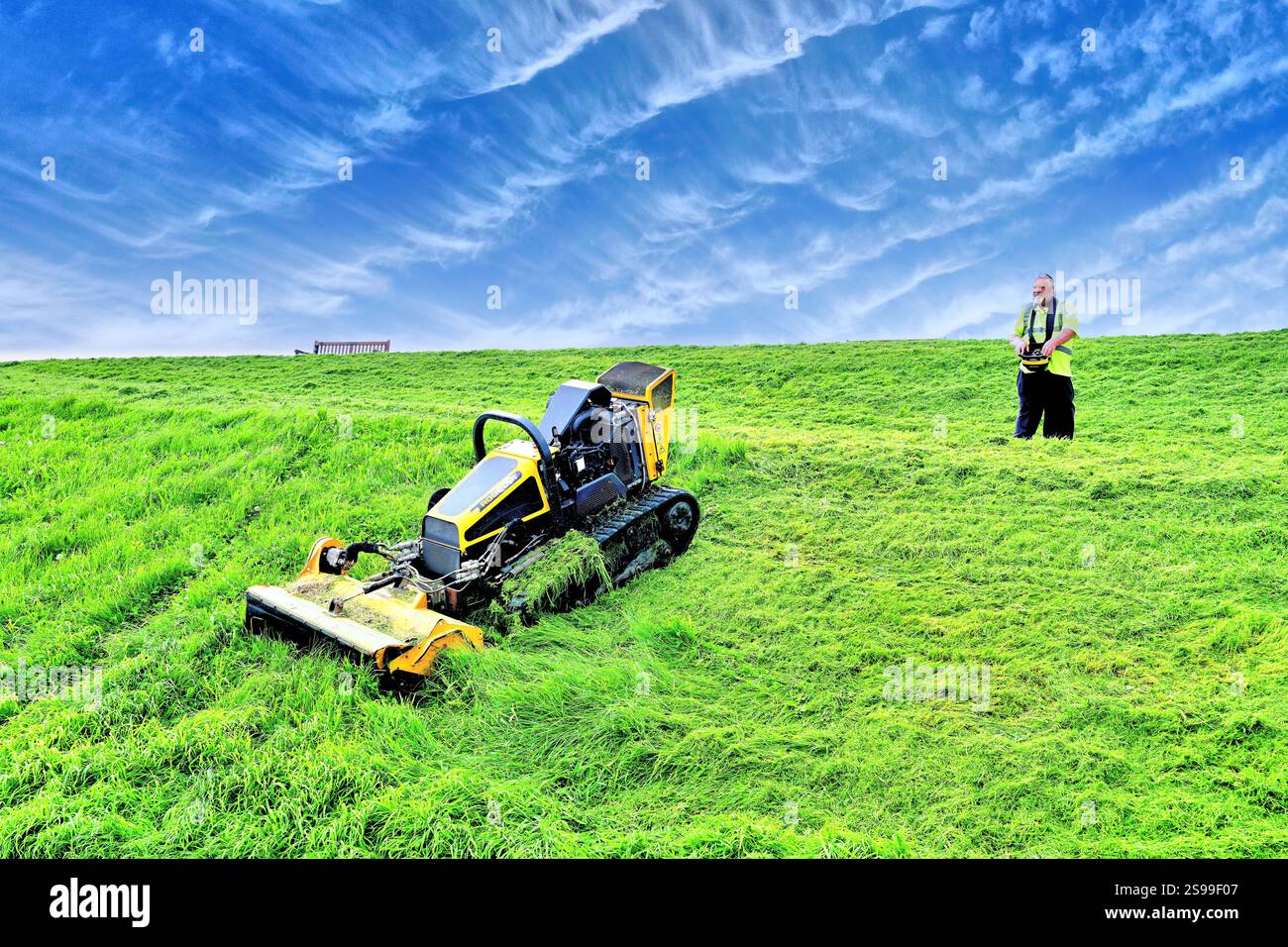 North Tyneside council workert using the radio controlled Robocut grass ...