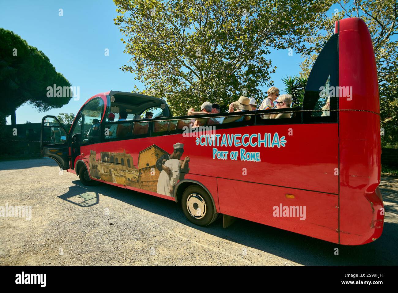 Civitavecchia. Italy - January 25, 2025: A vibrant red tourist bus with ...