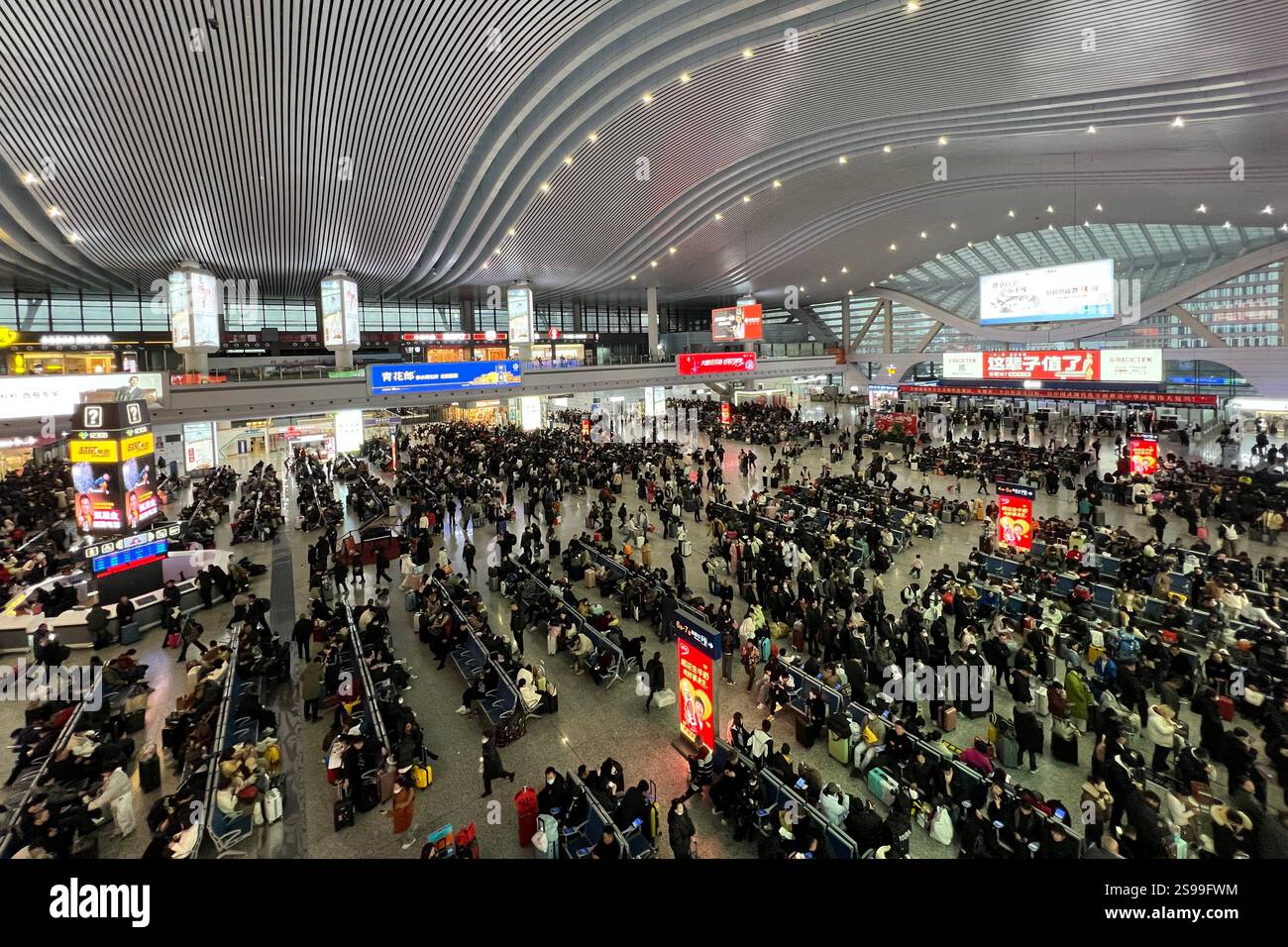 NINGBO, CHINA - JANUARY 25, 2025 - A large number of passengers wait at ...