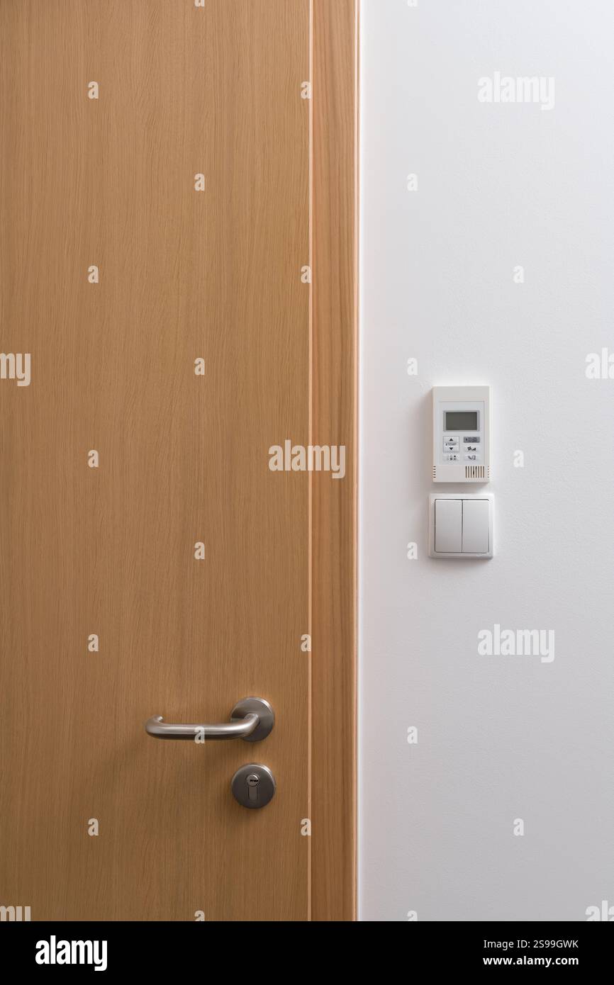 Modern Interior with Wooden Door and Control Panel Stock Photo - Alamy