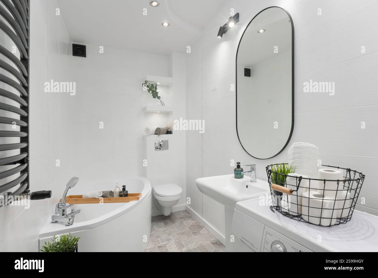 Modern White Bathroom with Bathtub, Sink and Toilet Stock Photo - Alamy