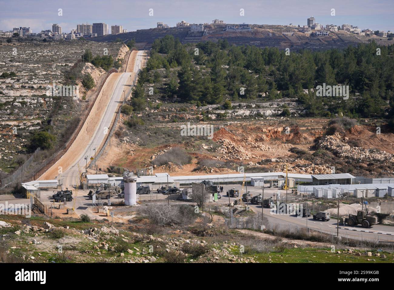 Military vehicles are lined up at the Israeli Ofer prison in the West ...