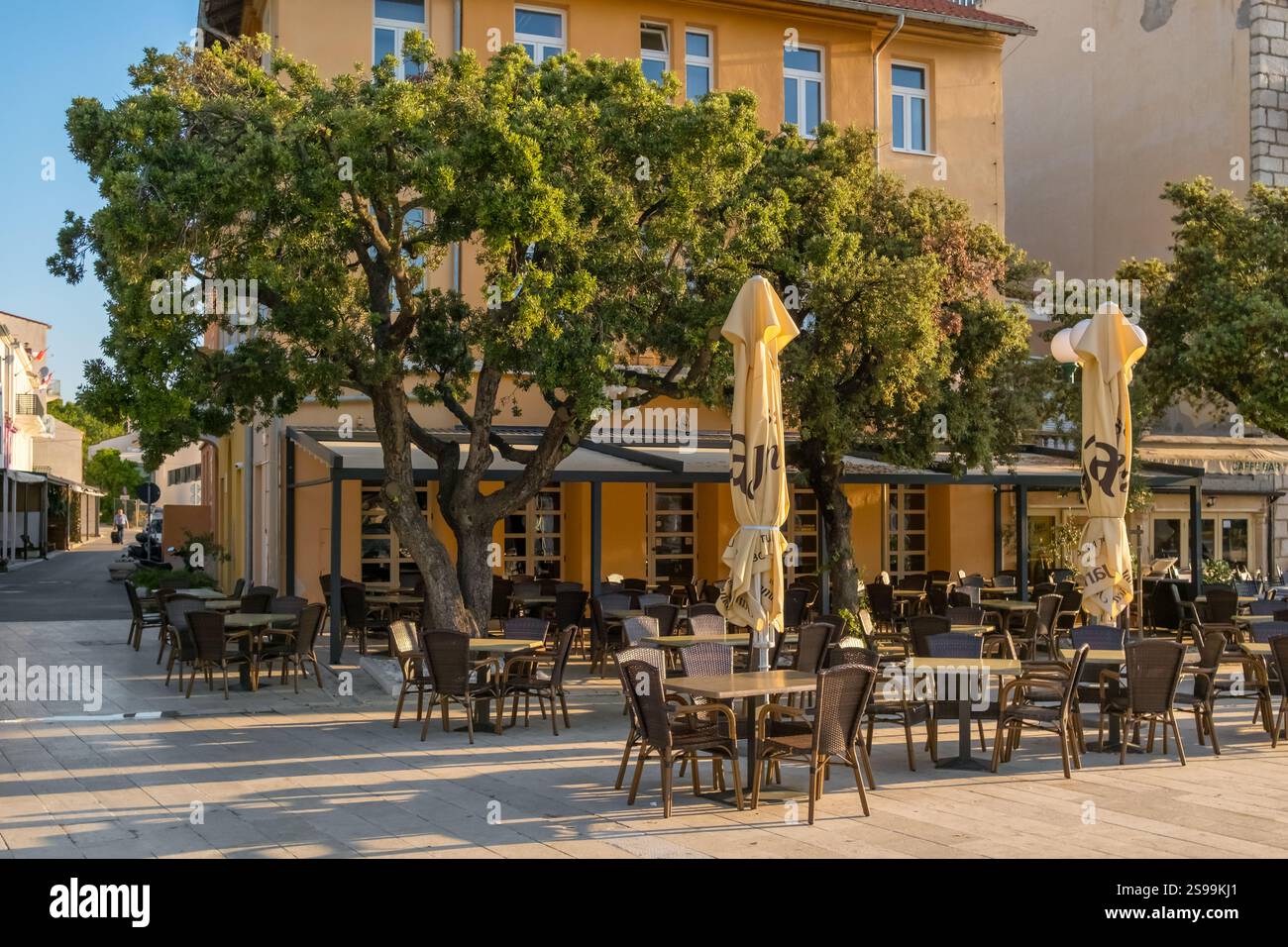 Cozy outdoor cafe in the Rab town on the Croatian island of Rab ...