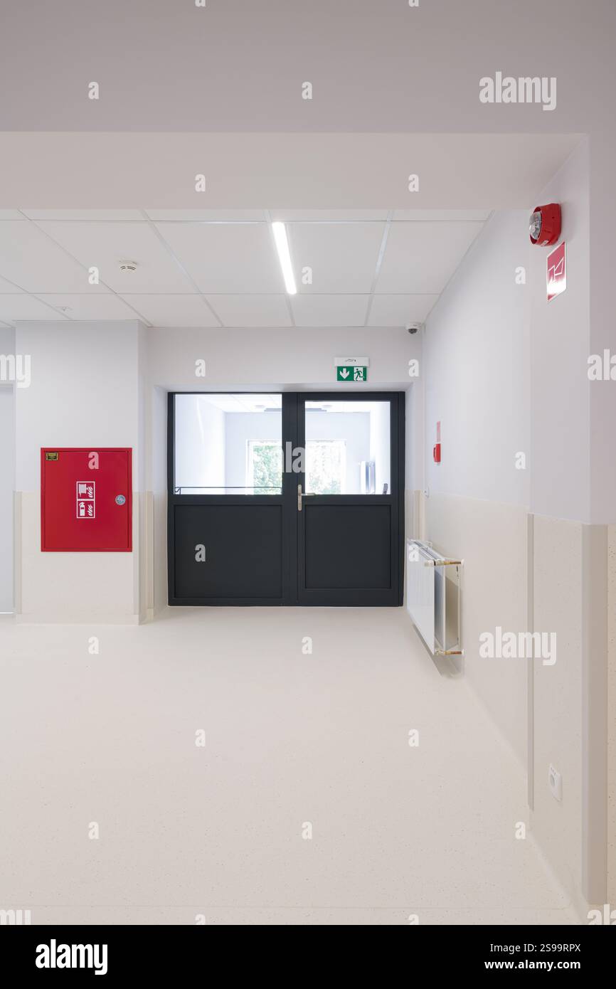 Modern Hallway with Double Doors and Fire Safety Elements Stock Photo ...