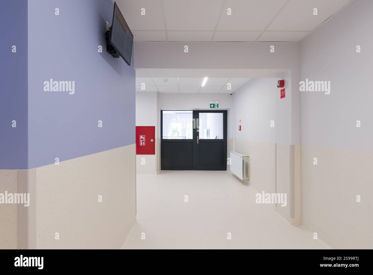 Modern Hallway with Fire Safety Equipment and Monitor Stock Photo - Alamy