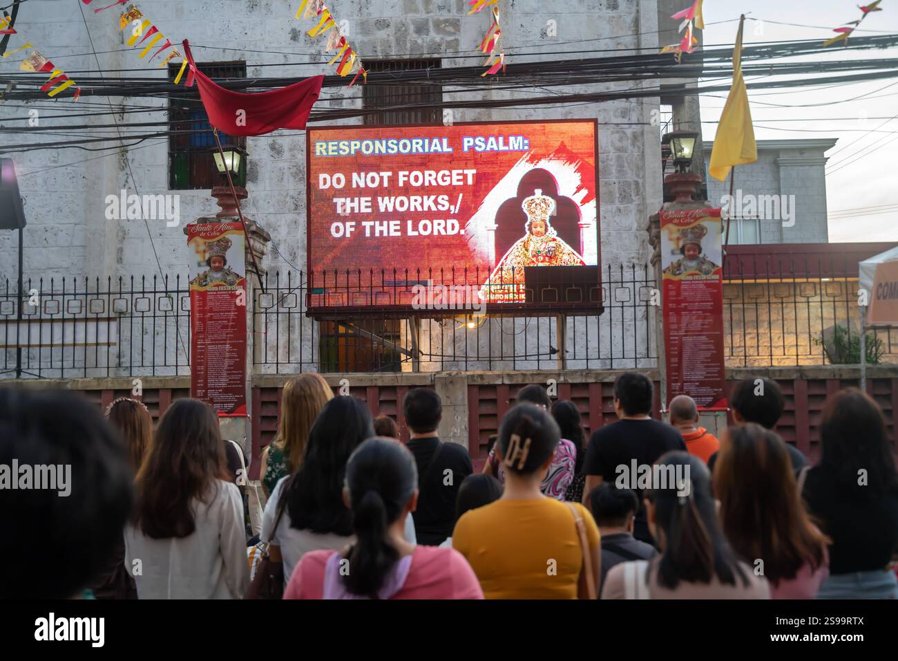 Outdoor screen during Catholic mass, Cebu Philippines. Showing city ...