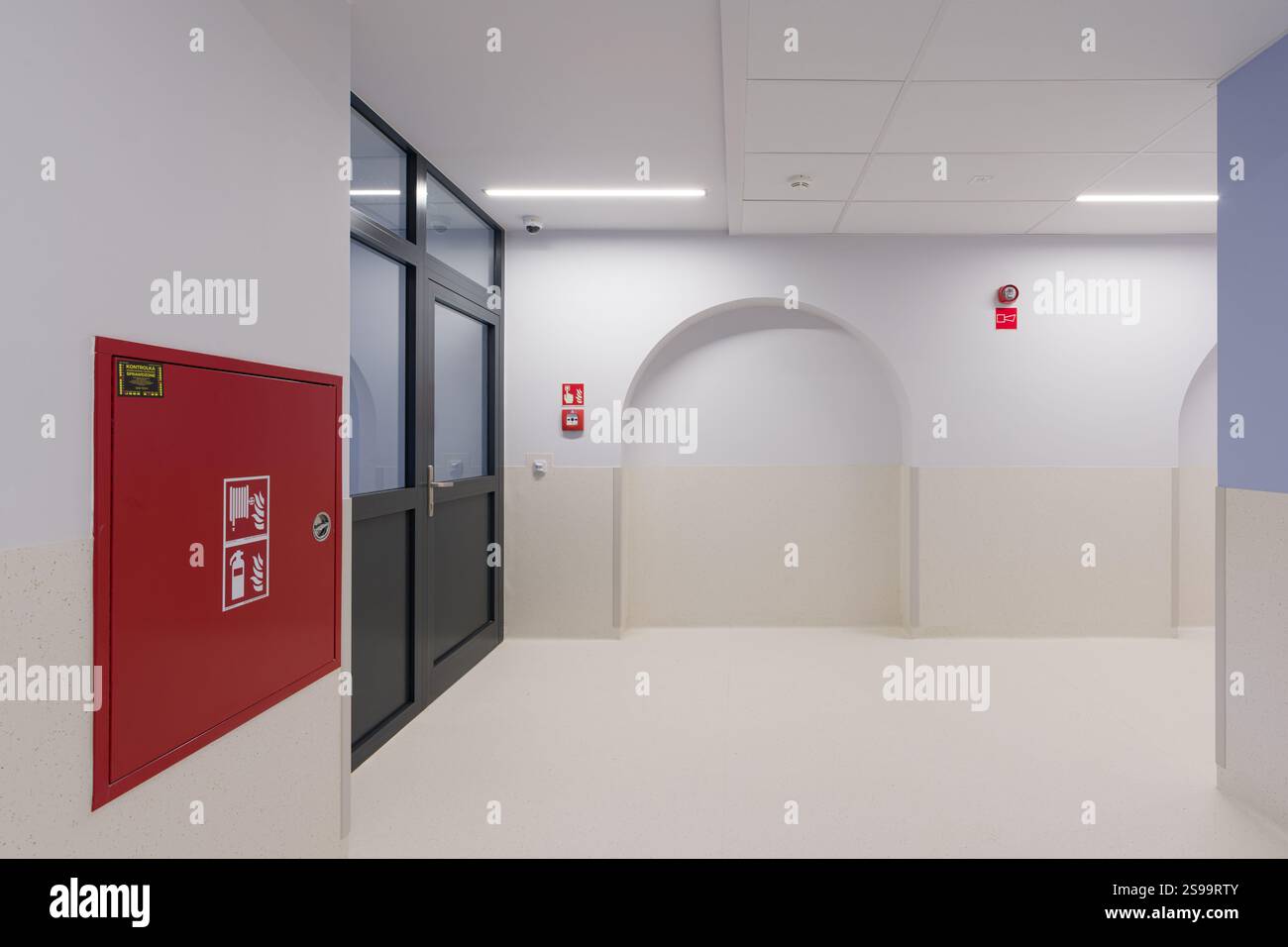 Modern Hallway with Arches, Fire Safety, and Minimalist Design Stock ...