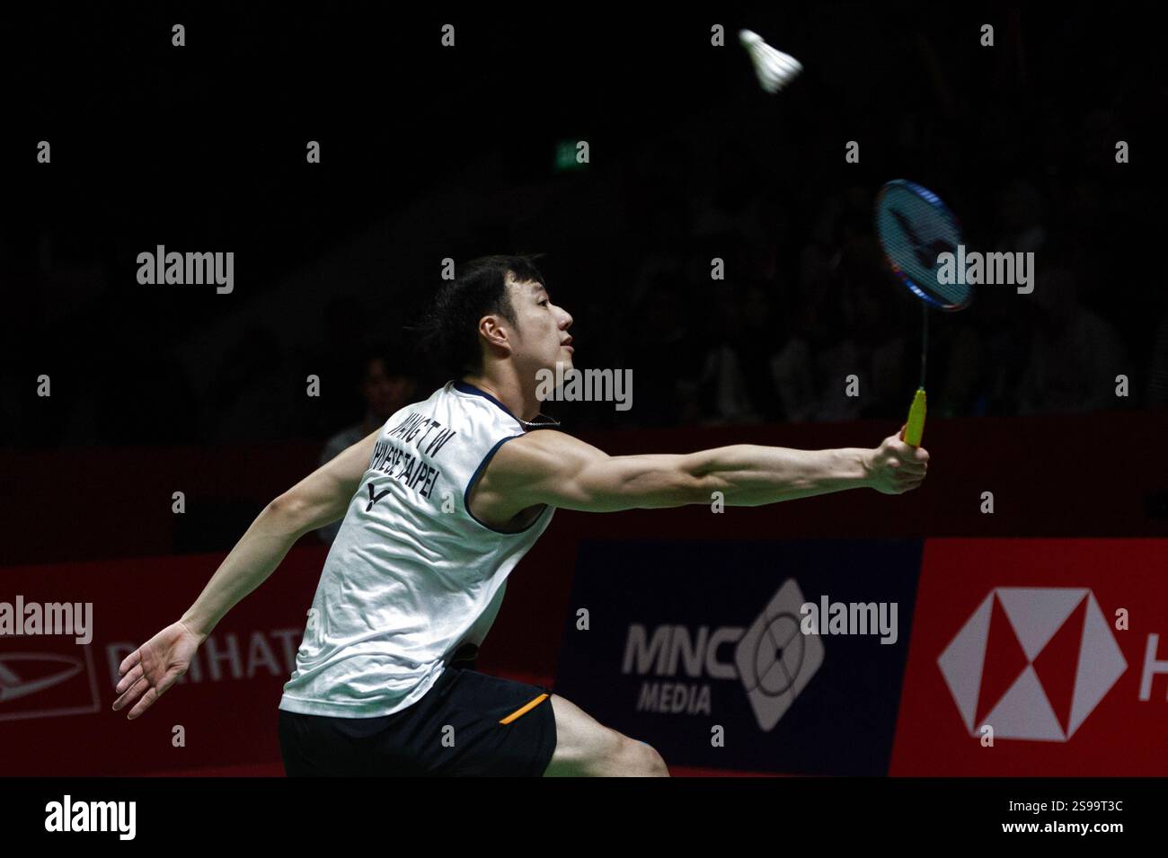 (250125) -- JAKARTA, Jan. 25, 2025 (Xinhua) -- Wang Tzu Wei hits a return during the men's ...