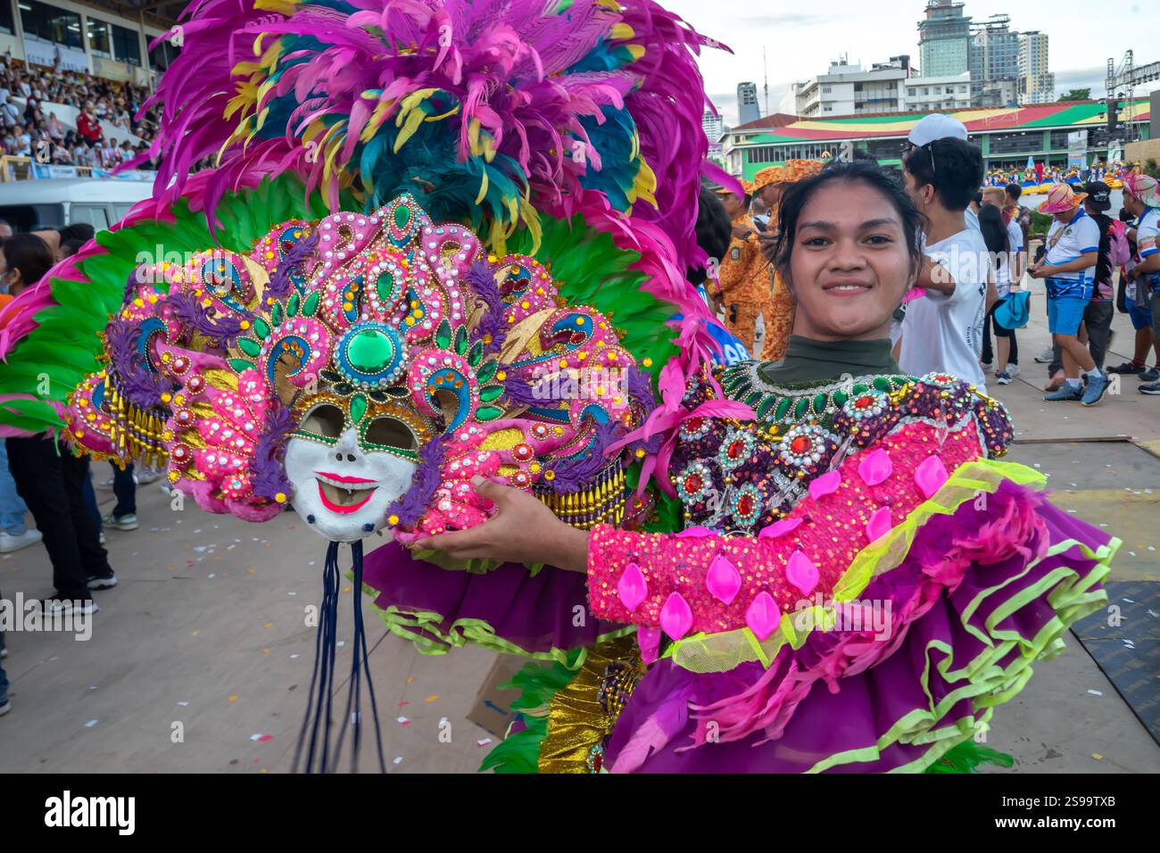 2025 Teen girl performer posing with her mask at Sinulog festival in ...