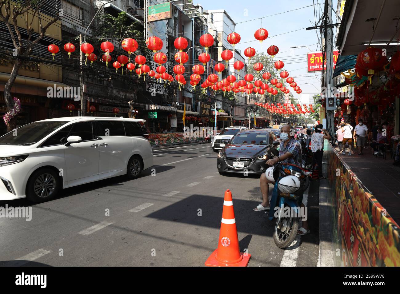 BANGKOK, THAILAND January 25, 2025 - A street in Yaowarat is decorated with red lanterns, an ...