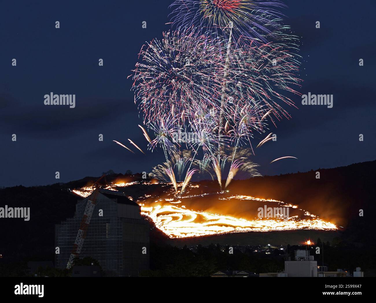 A composite photo shows the grass of Mt. Wakakusa burning with a ...