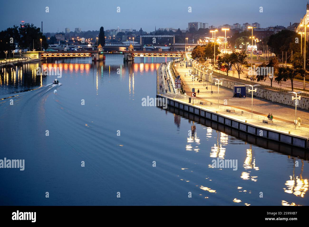 Cityscape with River, Bridges, and Lights at Night in Szczecin, Poland ...