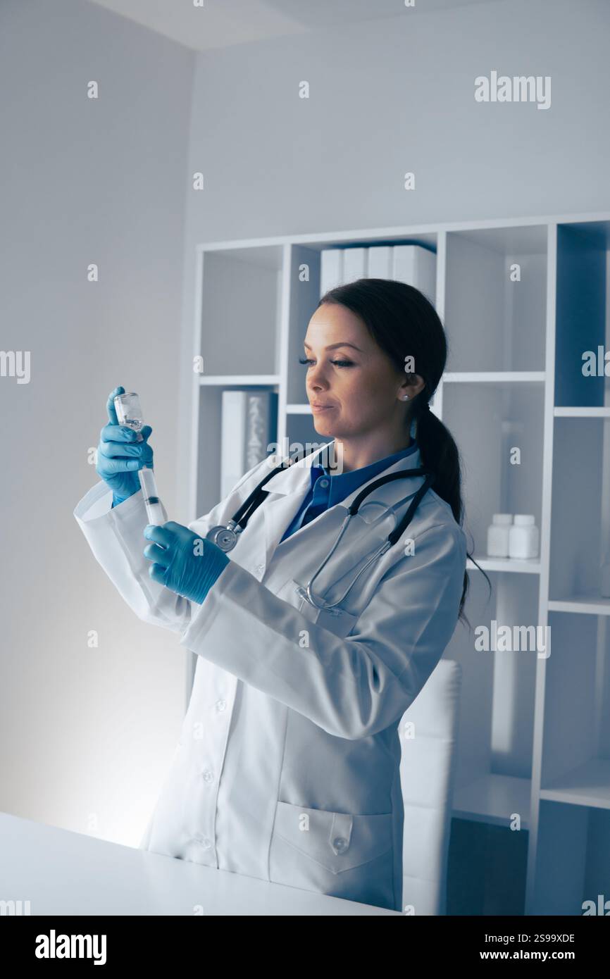 In a modern medical office, a dedicated female doctor prepares a ...