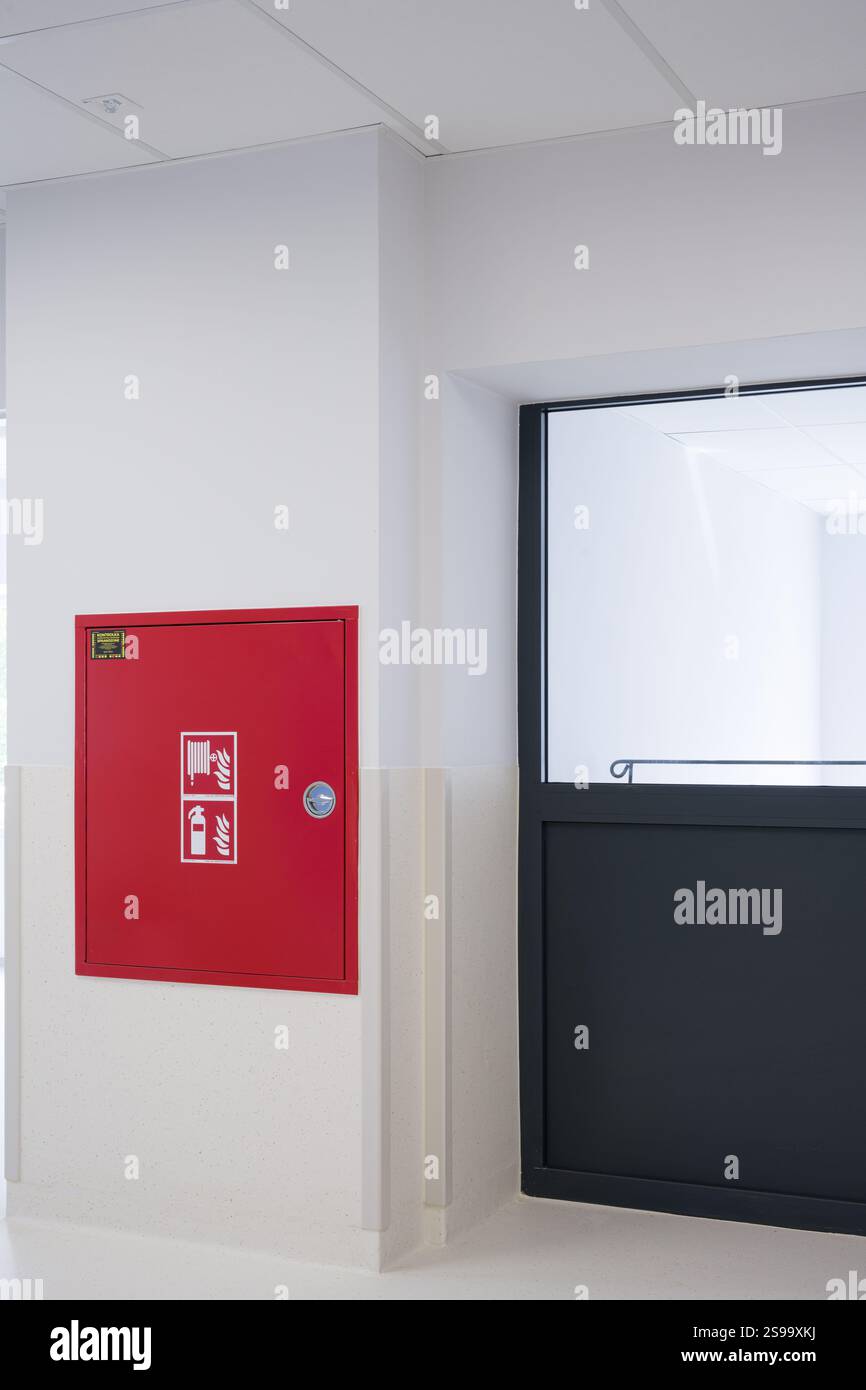 Red Fire Hose Cabinet in a Modern Building Stock Photo - Alamy
