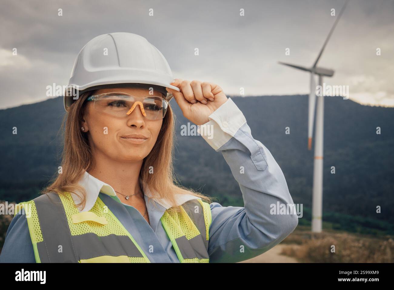 A female engineer is depicted wearing safety gear while working at a ...