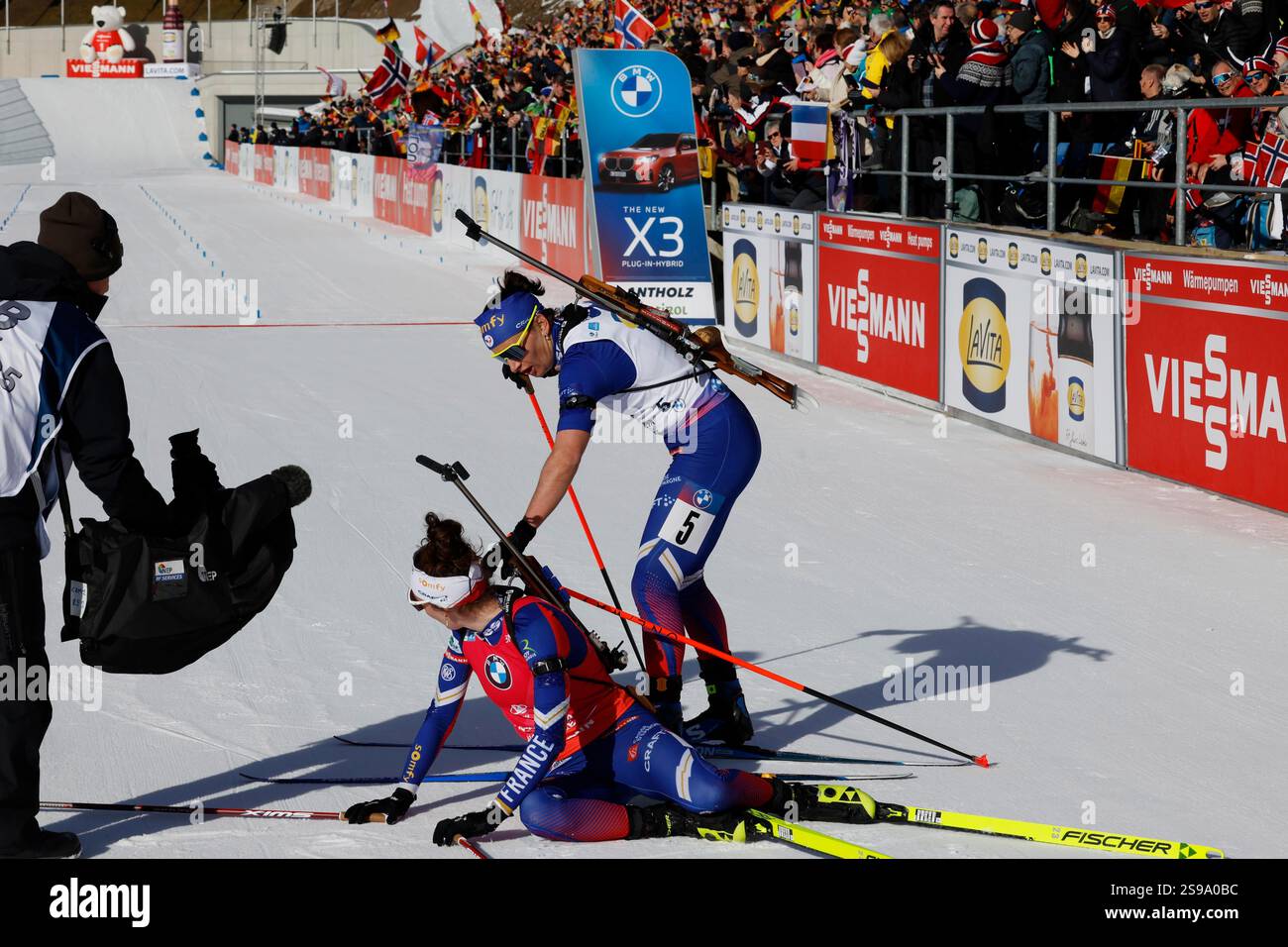 France's Lou Jeanmonnot on the ground after wining the women's Biathlon ...